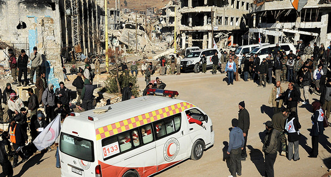People evacuated from besieged Syrian towns arrive in Damascus after ...