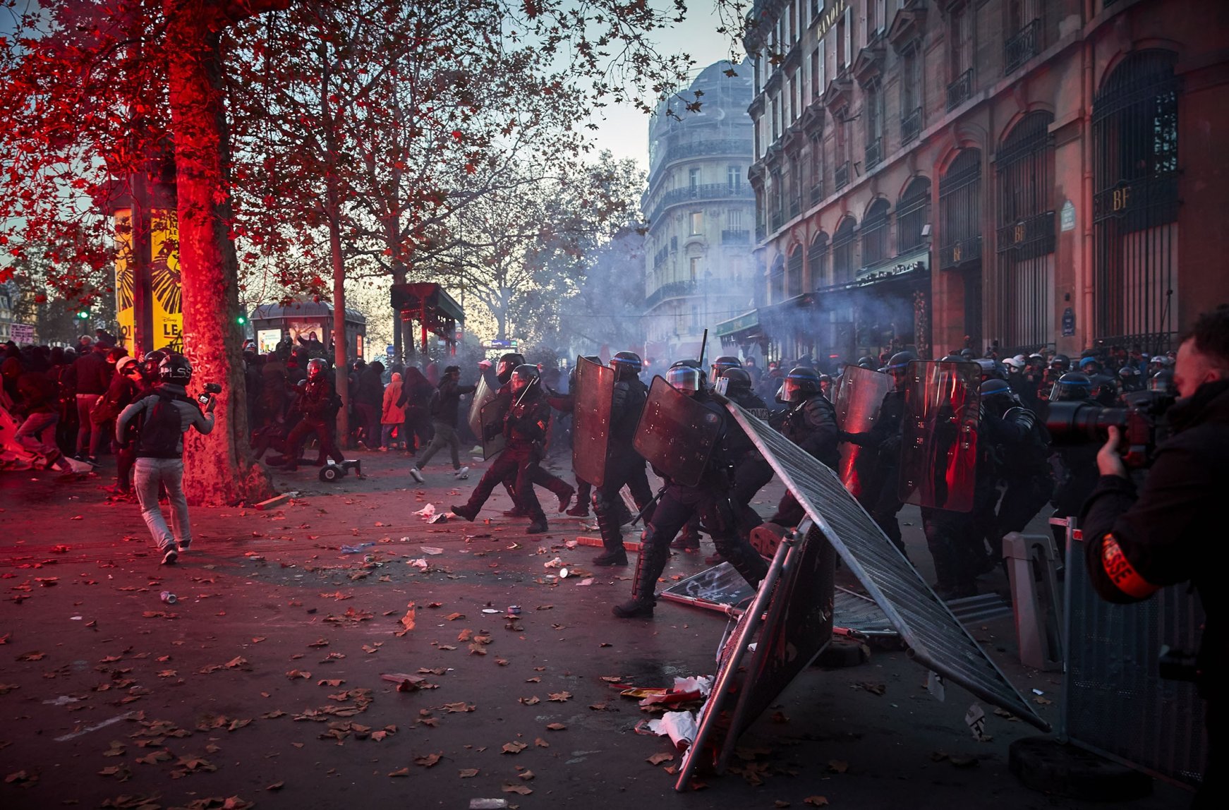 In photos: Clashes erupt at protest against police violence in Paris ...
