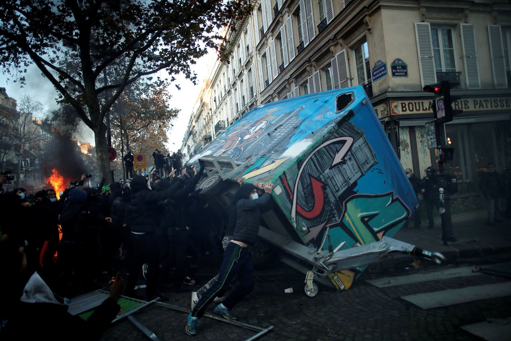 In photos: Clashes erupt at protest against police violence in Paris ...