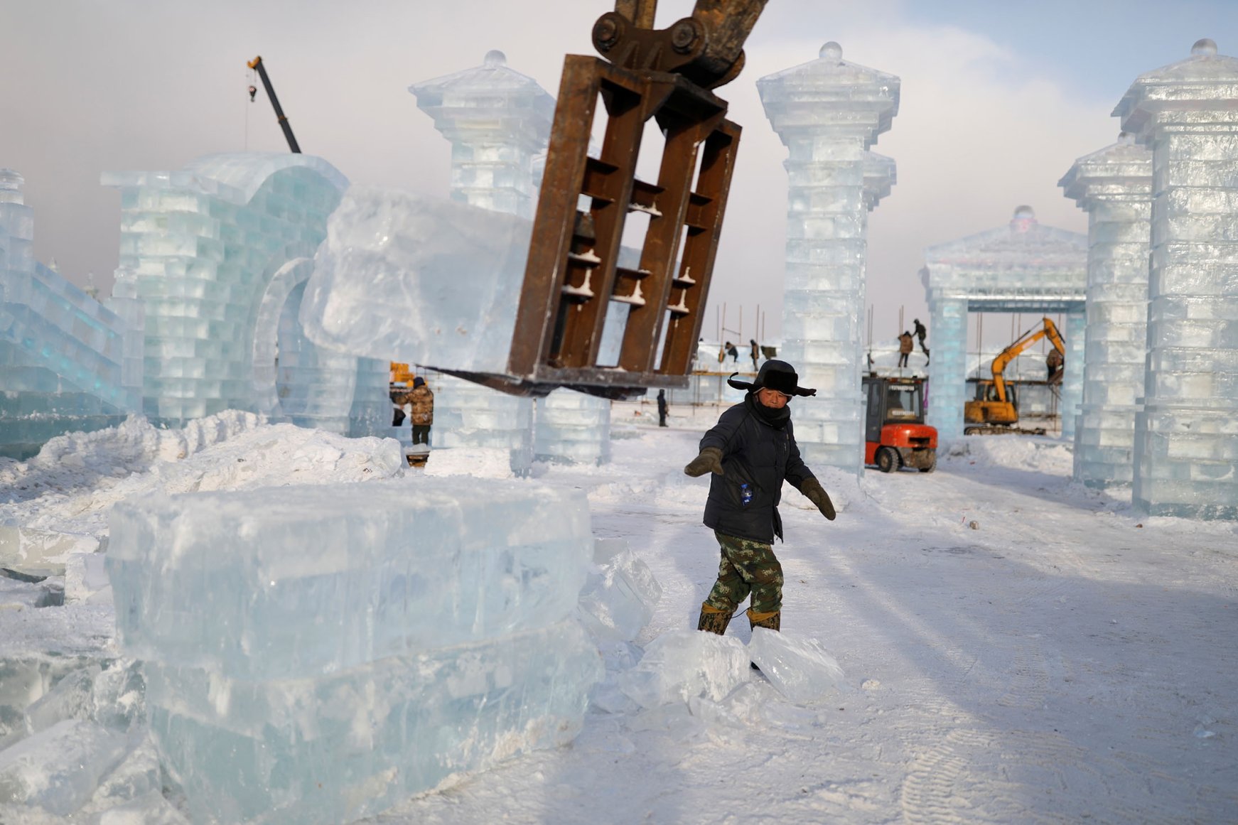 In photos: China's ice sculptors build frozen castles in the cold ...