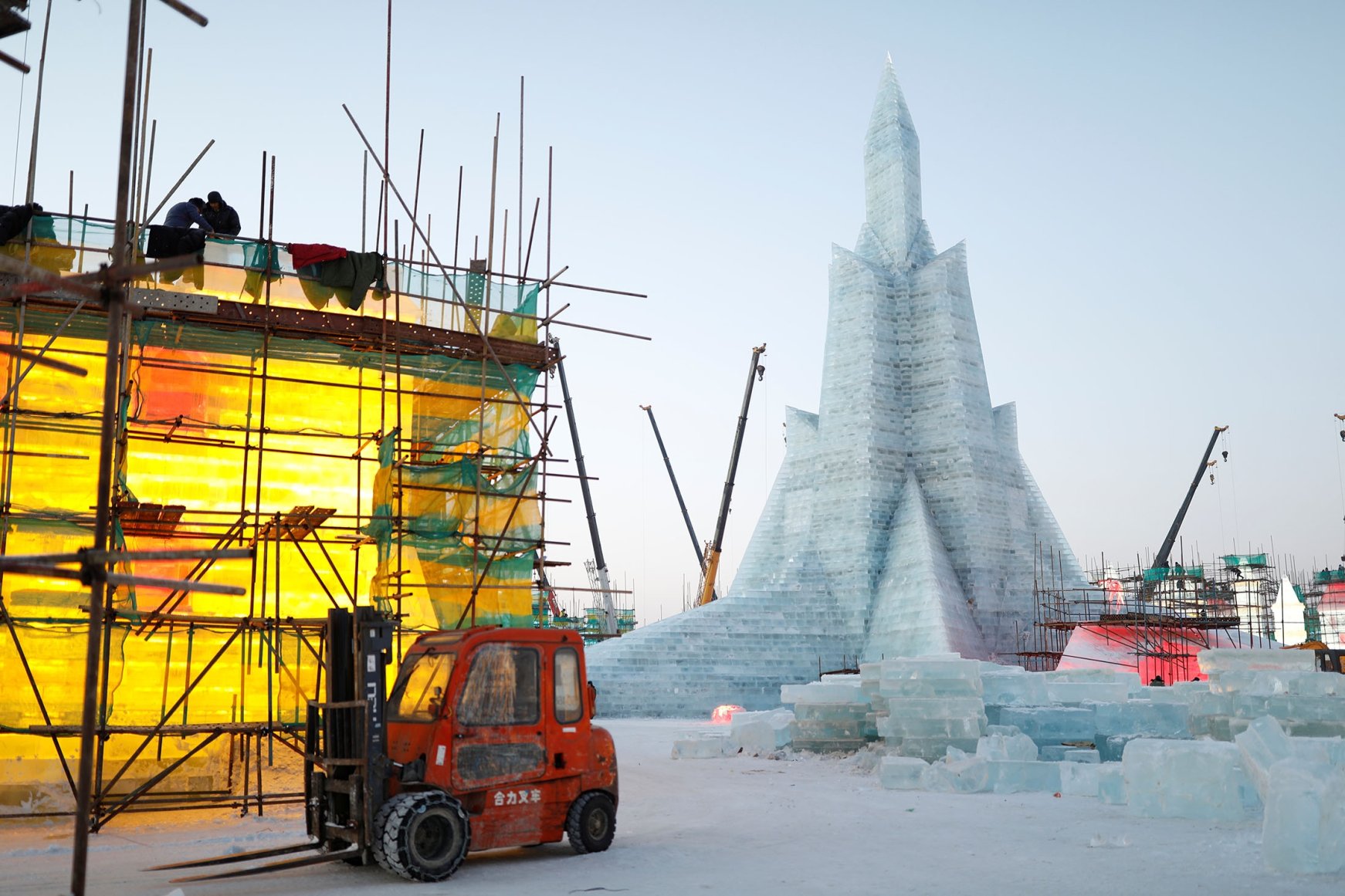 In photos: China's ice sculptors build frozen castles in the cold ...
