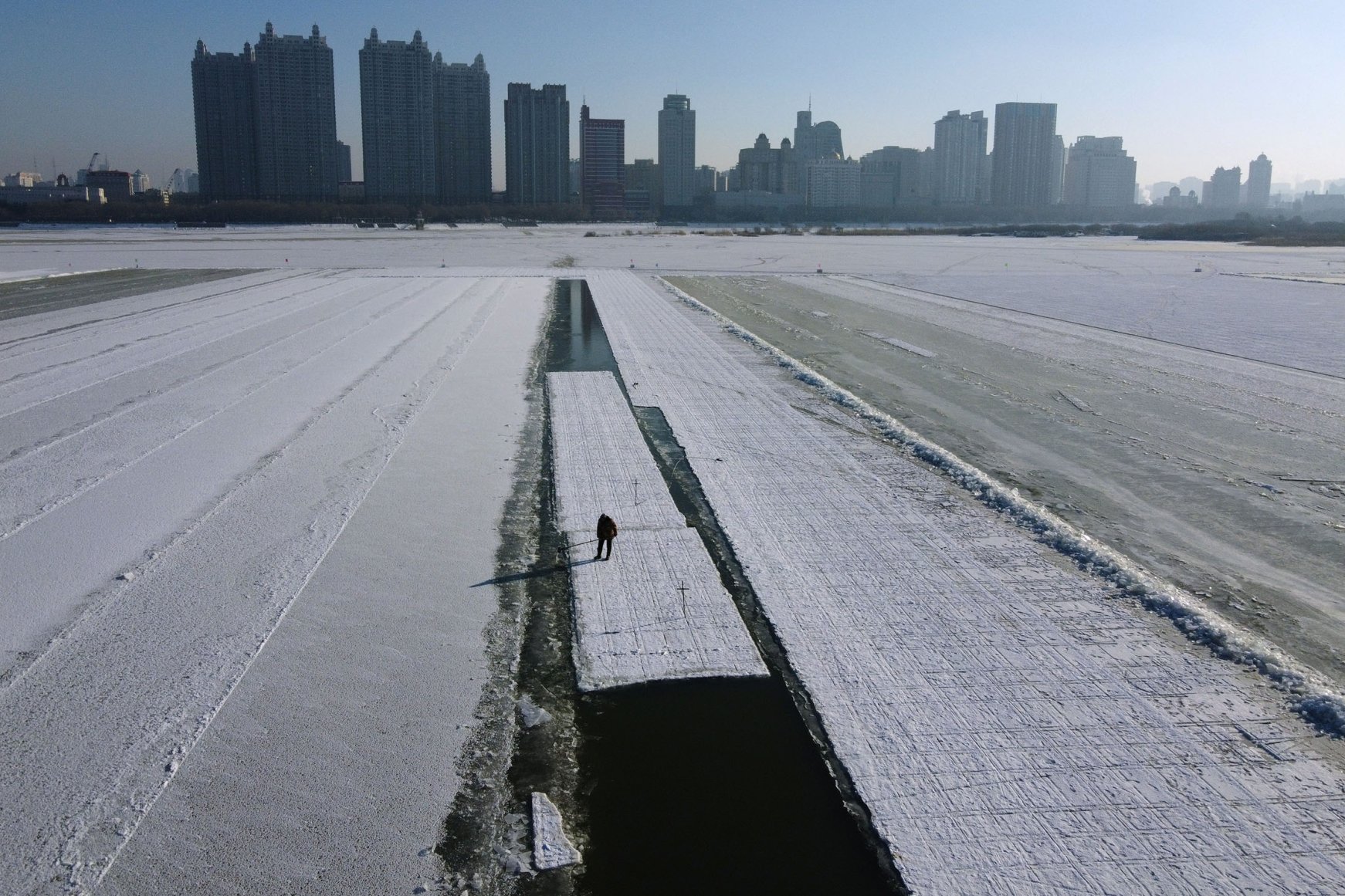 In photos: China's ice sculptors build frozen castles in the cold ...
