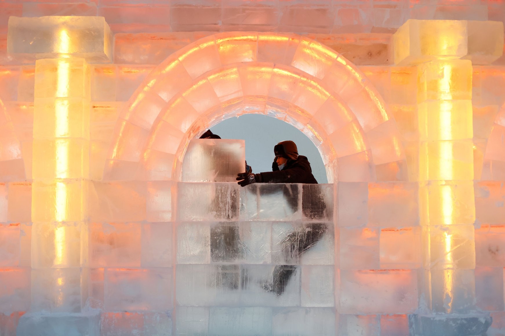 In photos: China's ice sculptors build frozen castles in the cold ...