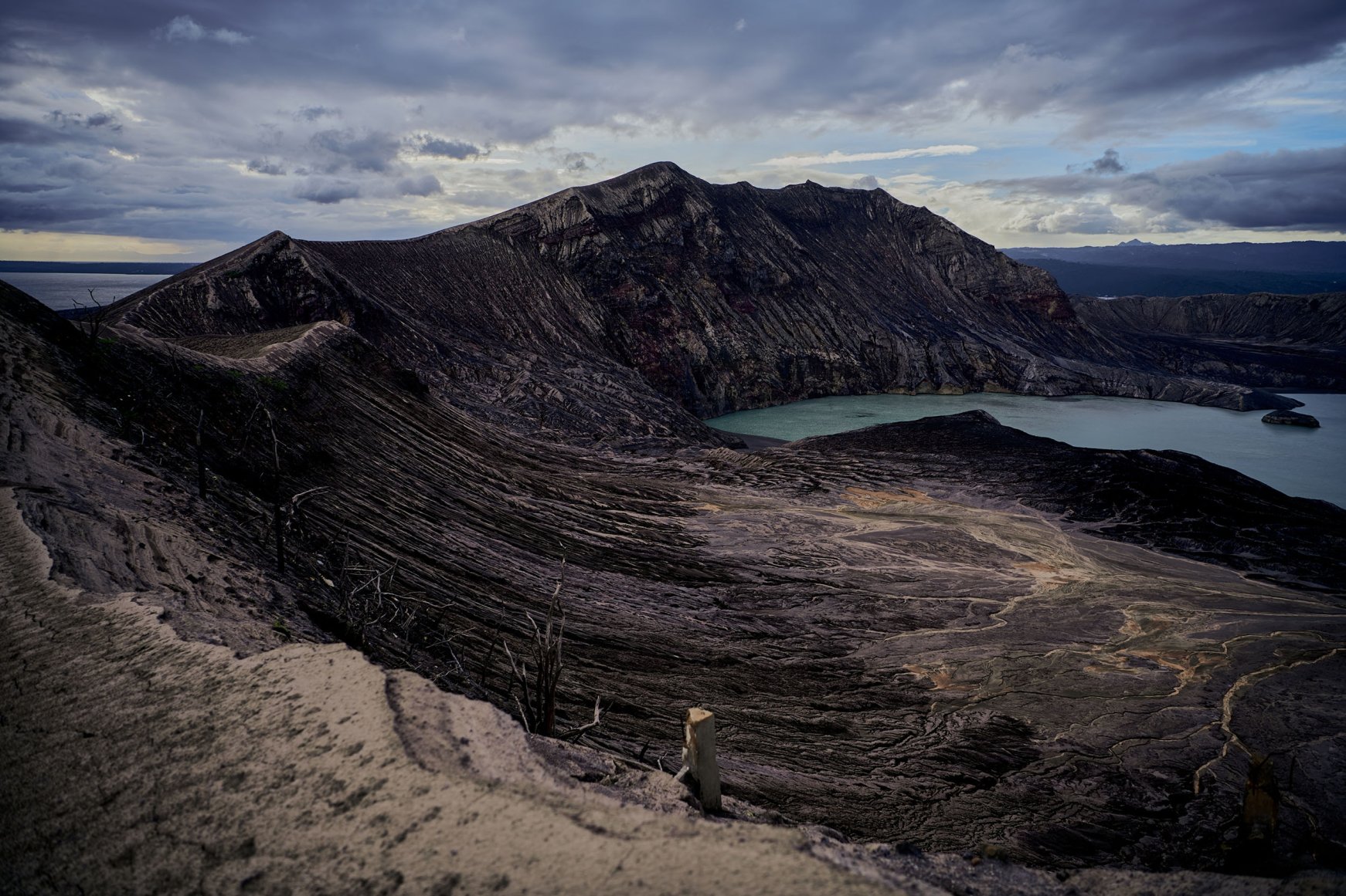 Eerie scenes on Philippines volcano island 1 year after eruption ...