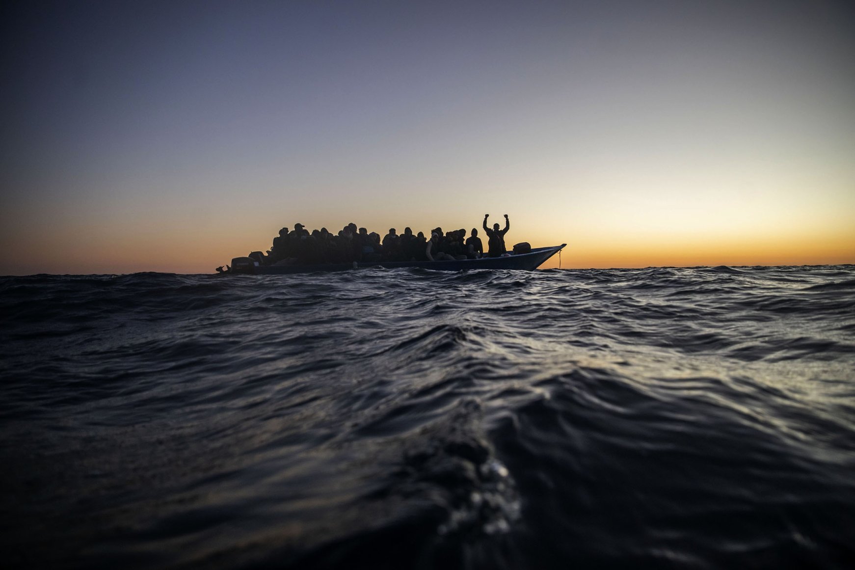 In photos: Migrants try to evade Libyan Coast Guard to flee country ...