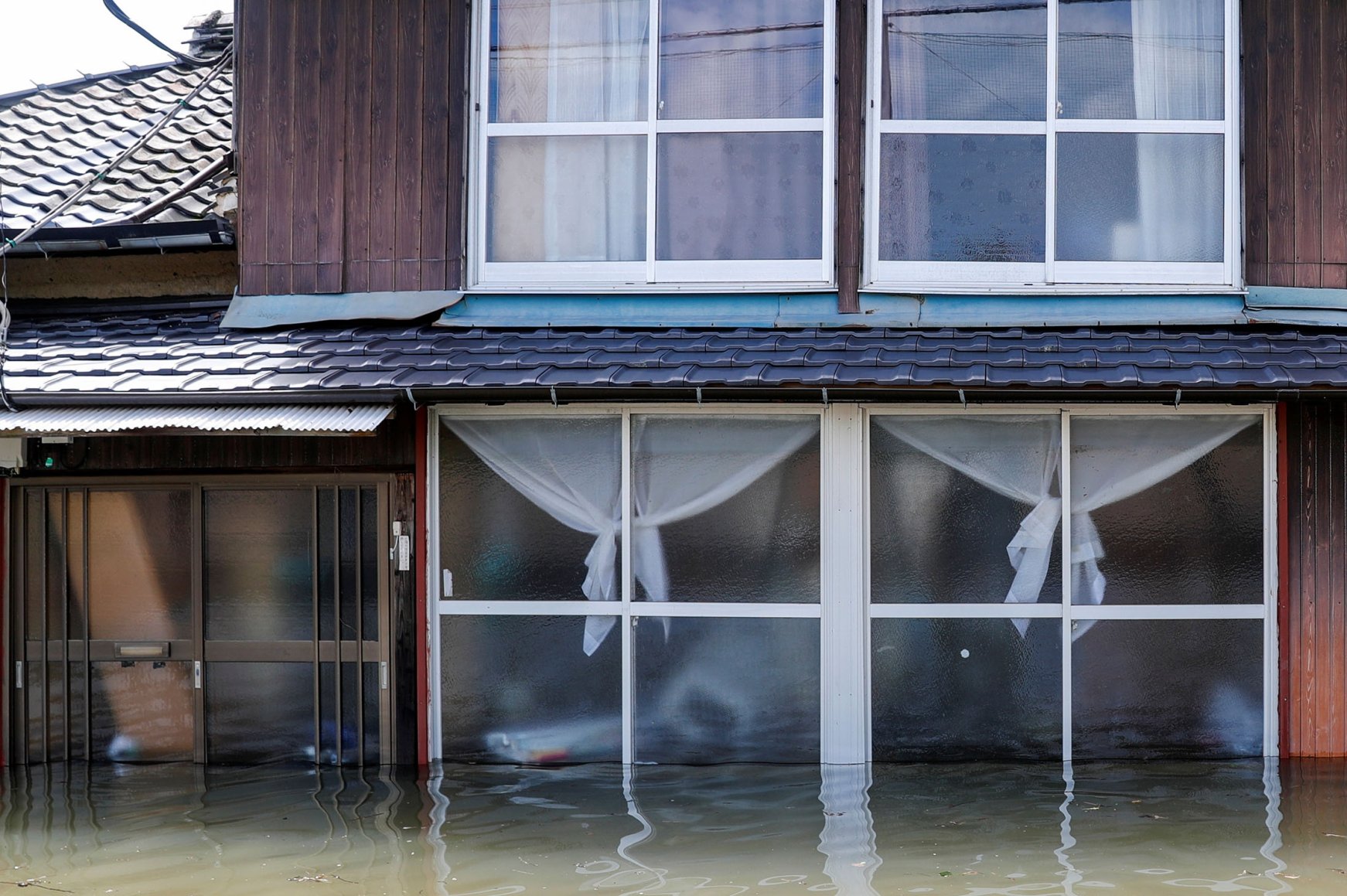 In photos: Japan hit by heavy rain, causing floods, landslides | Daily ...