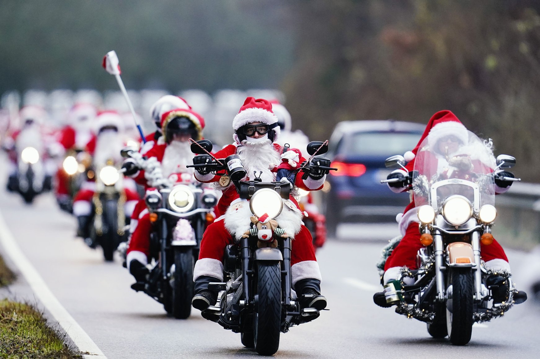 Under the sea, up on a building or a bike: Santas, Santas everywhere ...